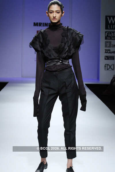 A model showcases a creation by designer Mrinalini on Day 3 of the ...