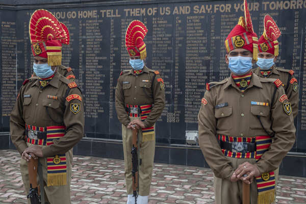 Border Security Force (BSF) soldiers bow their heads and pay respect to ...
