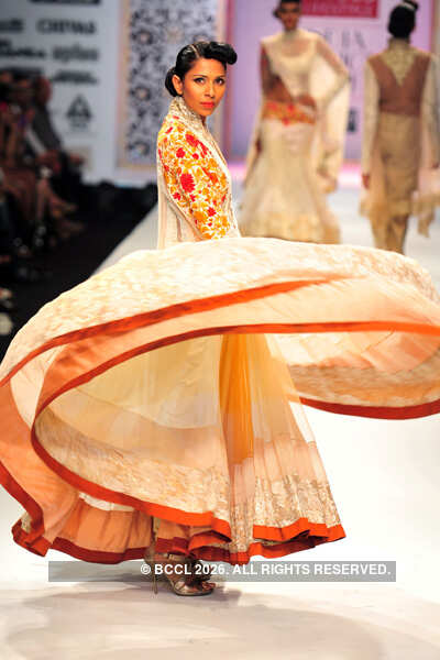 Candice Pinto showcases a creation by designer Manish Malhotra on Day 3 ...