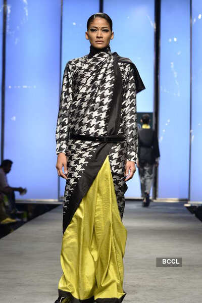 Michelle showcases a creation by designers Abraham and Thakore on Day 4 ...