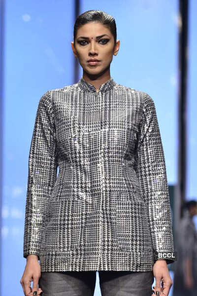 Alecia showcases a creation by designers Abraham and Thakore on Day 4 ...