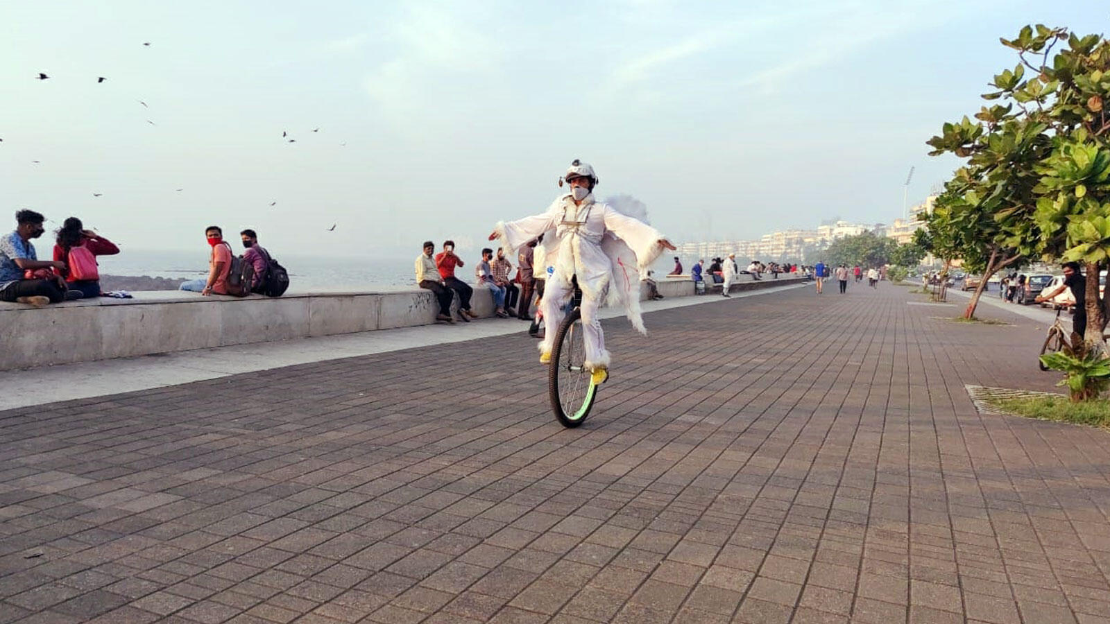 Dressed like a bird, social activist rides unicycle in Mumbai for a ...