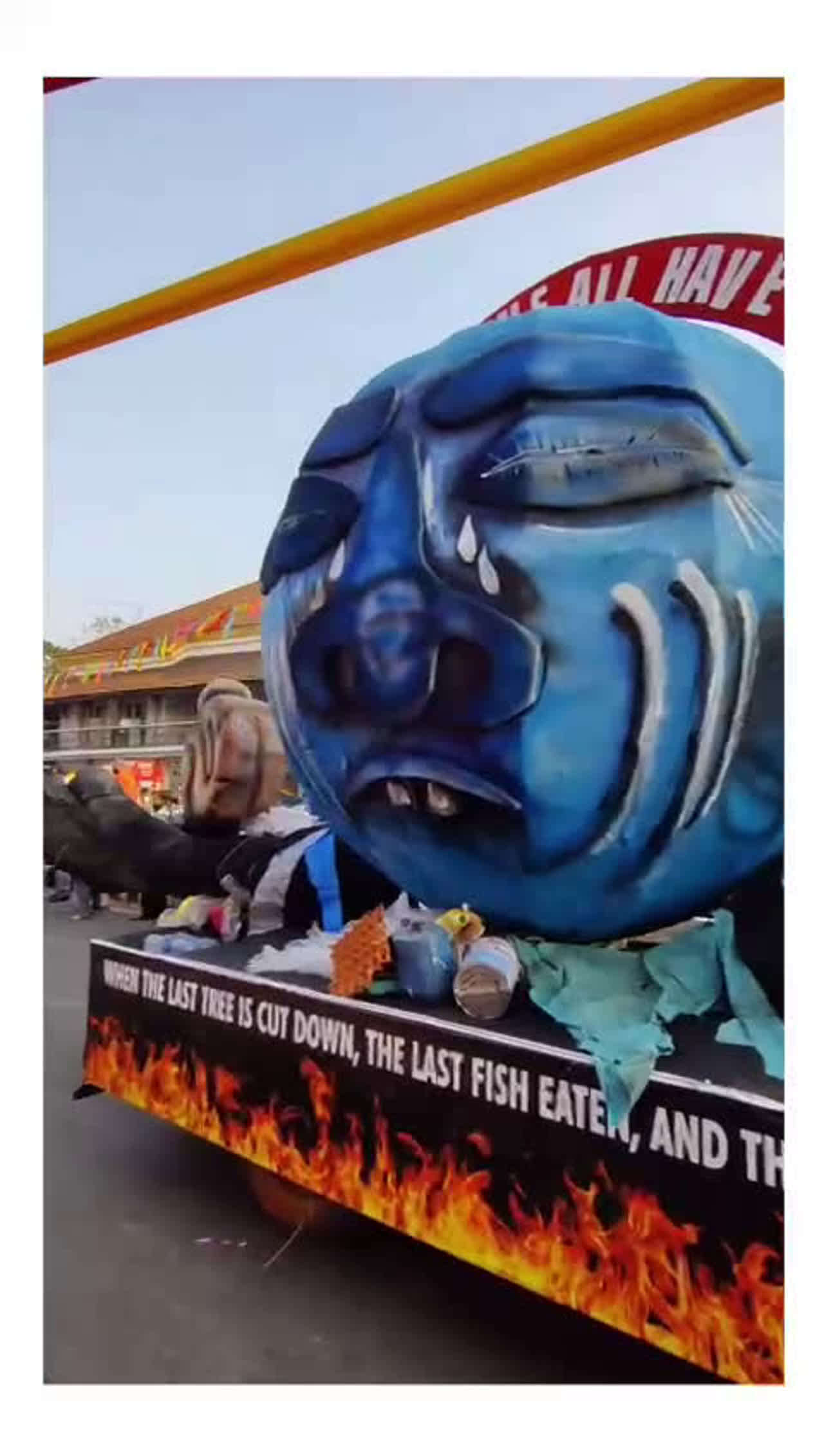 Floats depicting environmental issues, the pandemic situation and ...