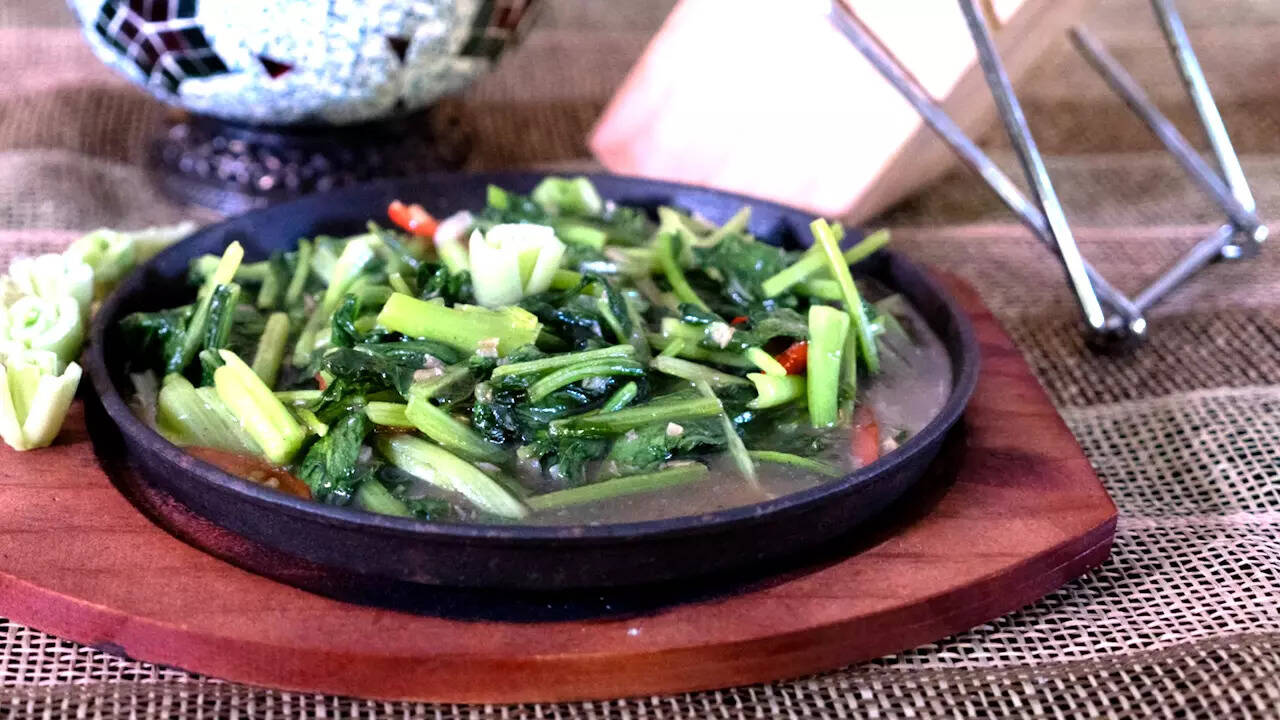 Watch: How to make Sautéed Green Mustard Leaves - Times Food