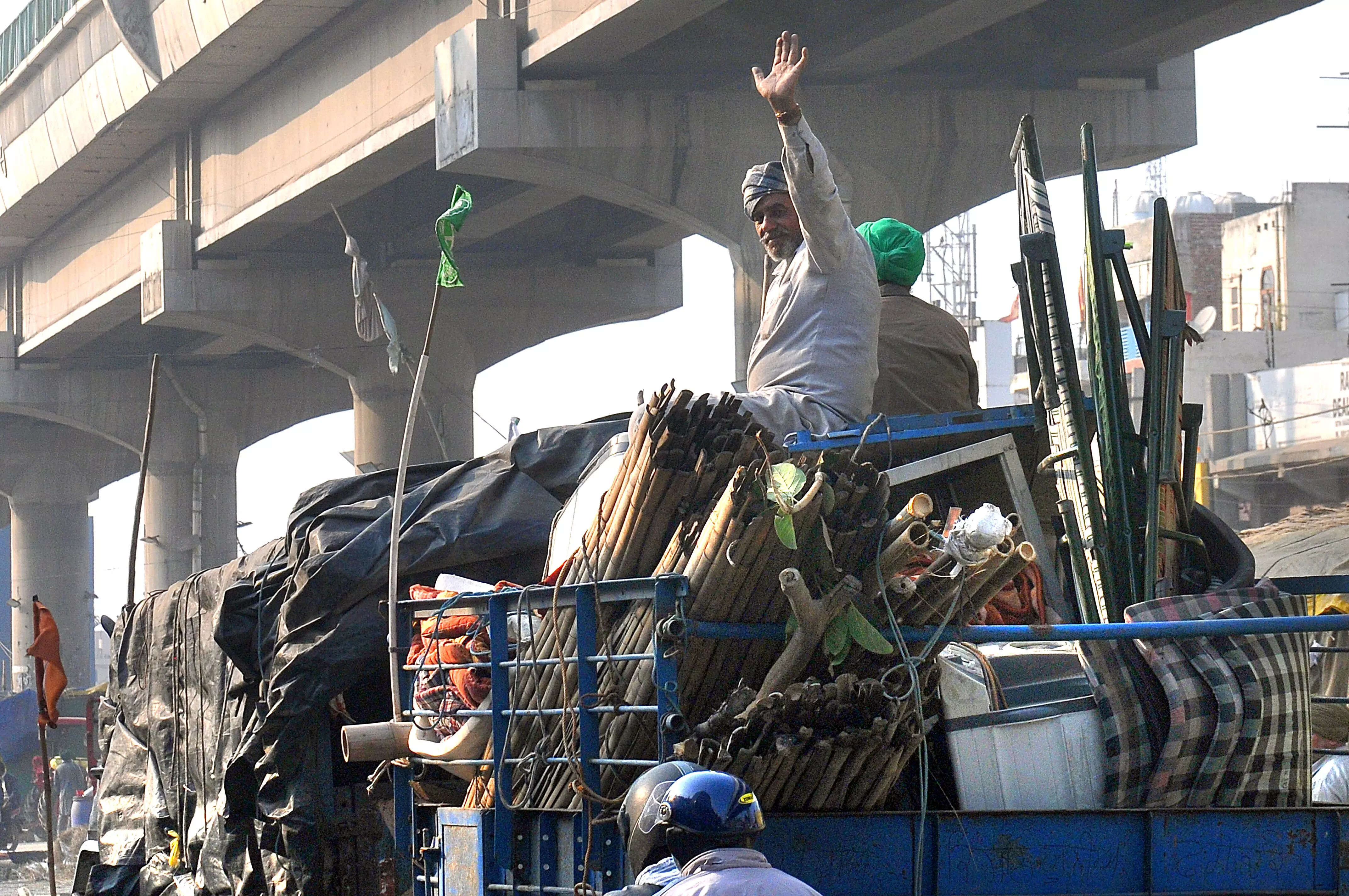 In pics: Farmers end year-long protest, start leaving for home