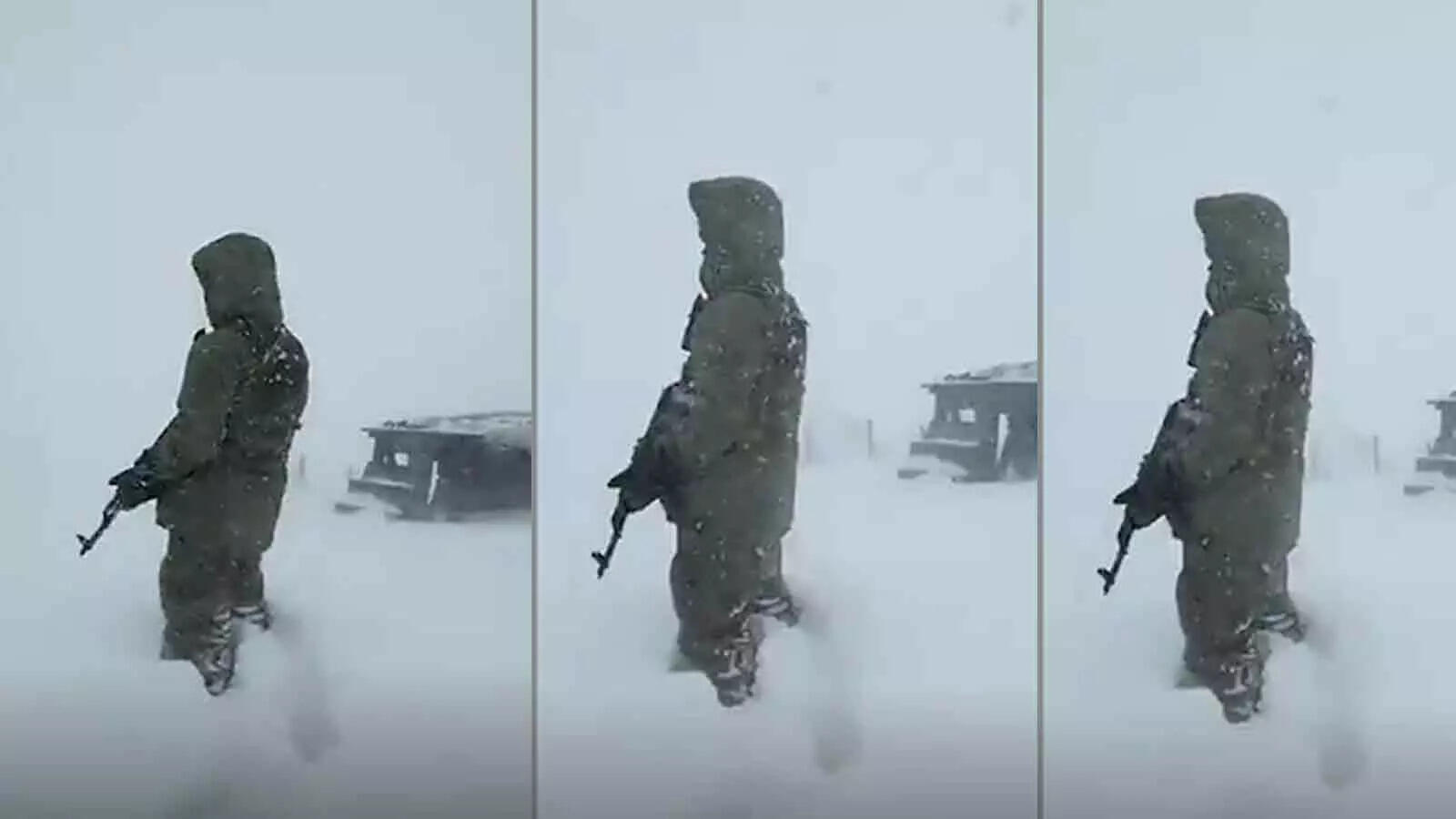 Duty before self: This soldier braves knee-deep snow to carry out his duty