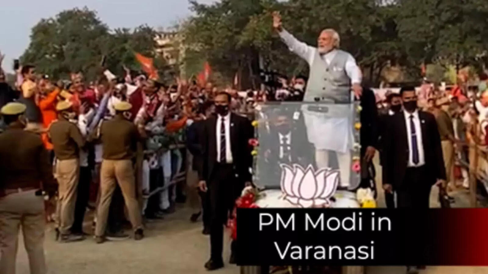 PM Modi greets people gathered for a public rally in Varanasi