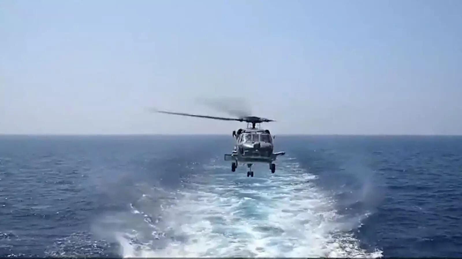 Watch: Royal Australian Navy chopper undertakes cross deck operations ...