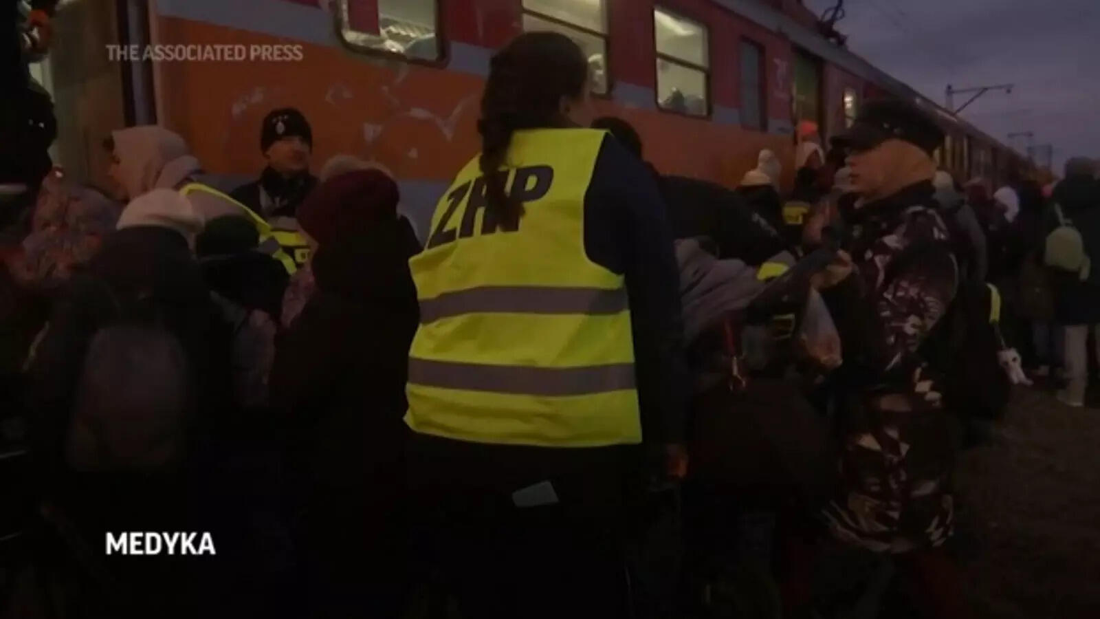 Ukrainian refugees board train from Polish border