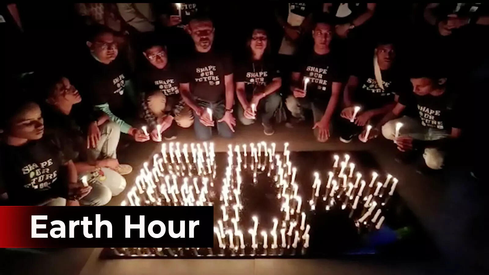 earth hour: Members of WWF take part in a candlelight vigil as they ...