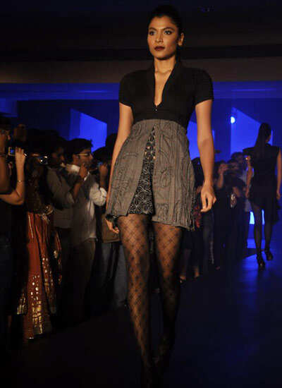 A model presents a creation during Blenders Pride Magical Nites fashion ...