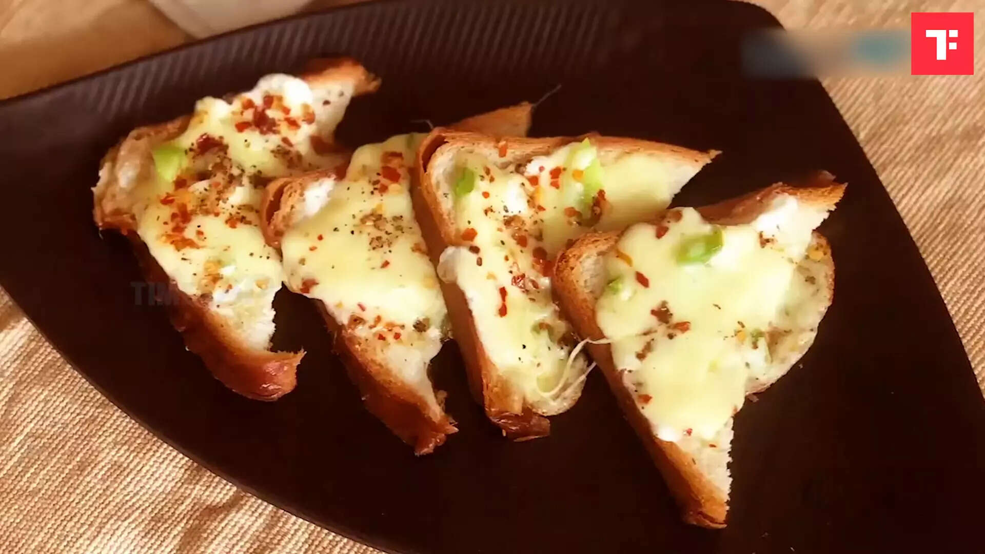 Watch: How to make Garlic Cheese Toast - Times Food