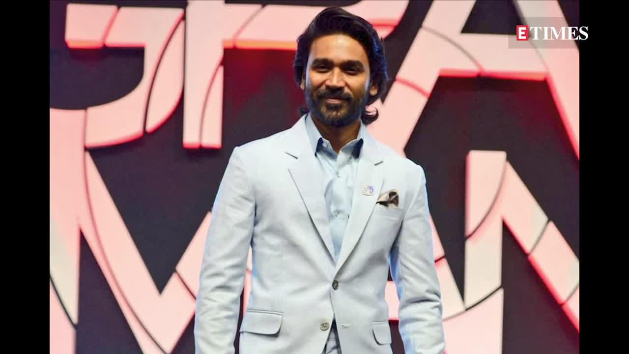 Dhanush appears in a traditional 'Veshti' and shirt at his movie premiere