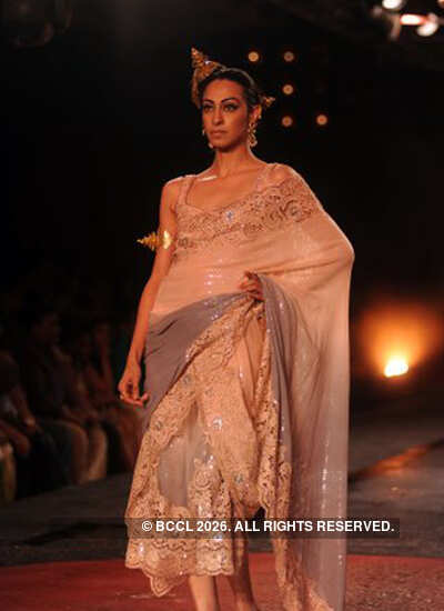 A model walks the ramp in a creation by designer Suneet Varma on Day 2 ...