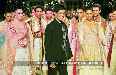 A model showcases a creation by designer Manish Malhotra on Day 3 of ...