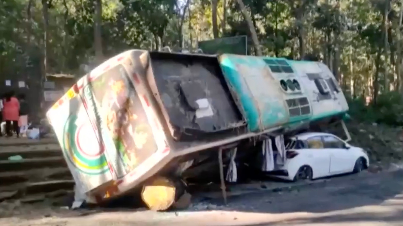 Watch: Tourist bus rammed into parked car