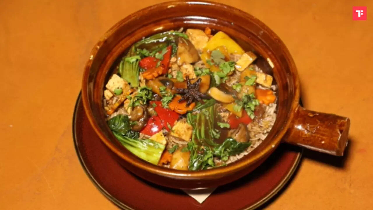 Watch: How to make Clay Pot Rice - Times Food