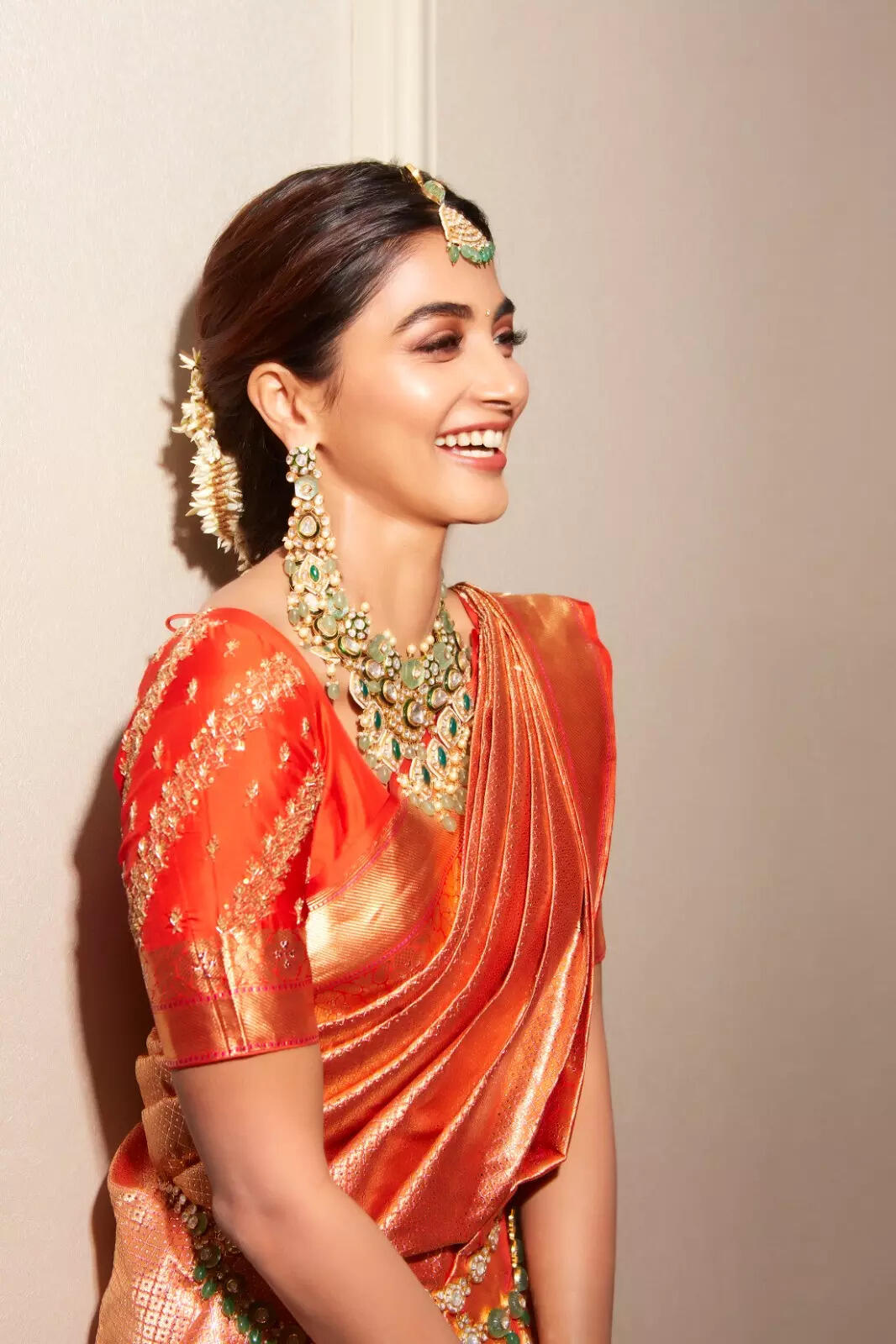 In photos: Pooja Hegde radiates elegance in orange at her brother’s ...