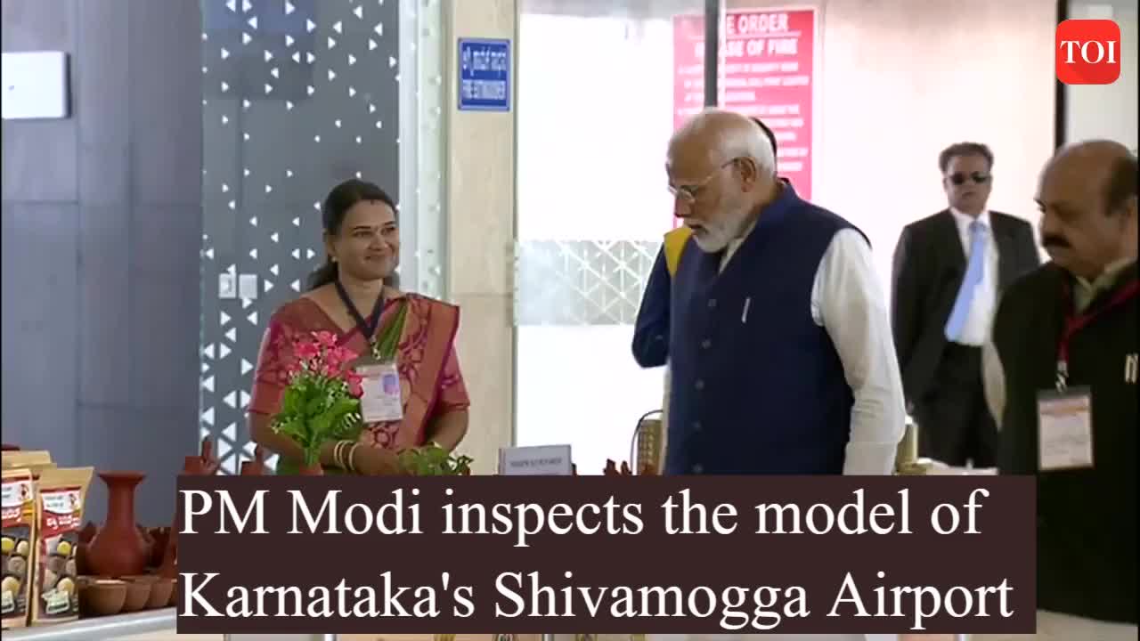 PM Narendra Modi inspects the model of Karnataka's Shivamogga Airport
