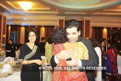 Karan Johar hugs Kiran Rao at the wedding reception of Gaurav and ...