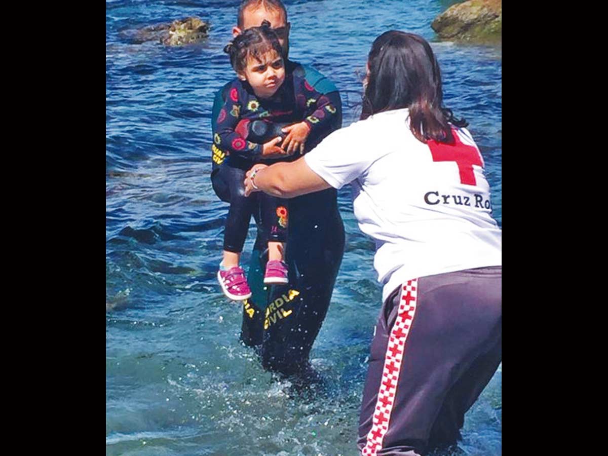 Thousands swim across to Spain from Morocco