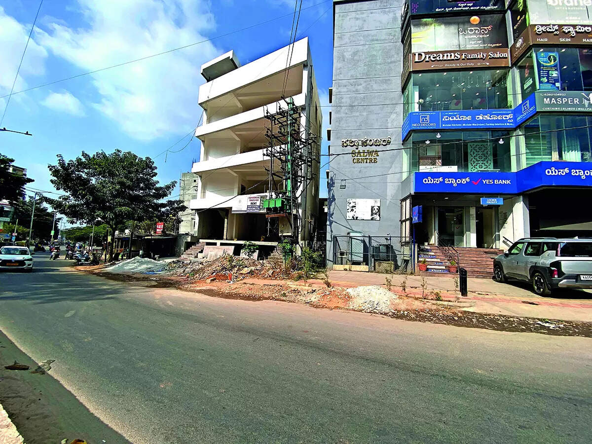 Newly upgraded footpath on Kanakapura Road in ruins