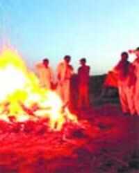 Three women perform last rites