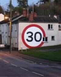 Man paints 15-ft high '˜go slow' sign on house