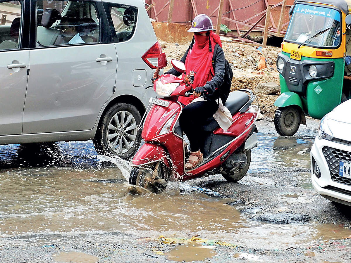 Bannerghatta Road is full of potholes and sewage, causing mile-long ...
