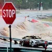 Dramatic rooftop rescues in Australia as floods kill four