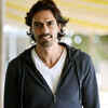 Arjun Rampal smiles into the camera during the media meet of the movie ...