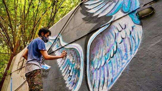 This graffiti artist is on a mission to beautify 100 walls in the city ...