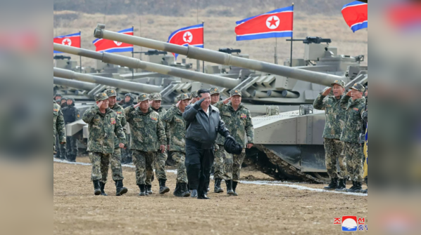 Kim Jong-un drives new tank in military drill