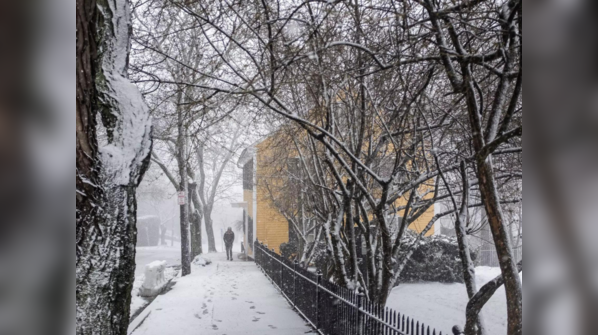 Heavy snowfall, freezing rain, icy roads: Striking photos of snow ...