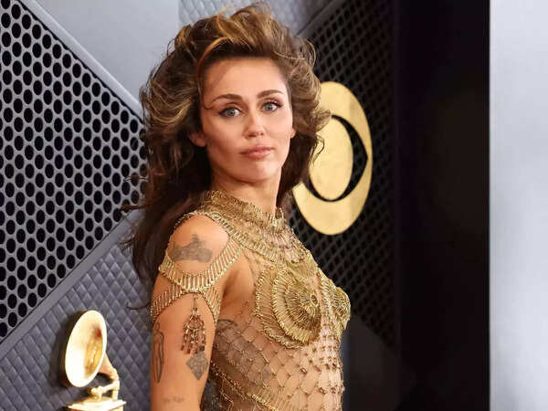 66th Grammy Awards: Miley Cyrus shines in daring gold ensemble at 66th ...