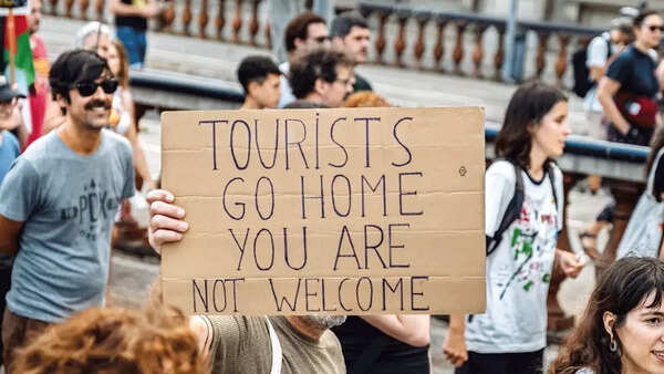 Bans, fines, taxes: Hotspots fight against overtourism - Times of India