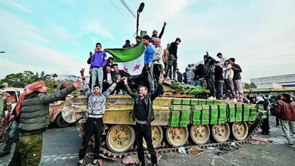 Gunfire Erupts As Rebels Celebrate Toppling Hama, Desecrate Statue Of ...