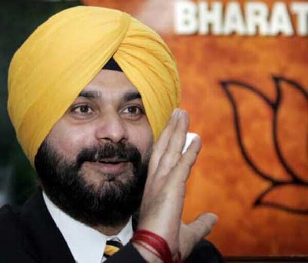 Sidhu comes under Sikh fire for fire ritual | India News - Times of India