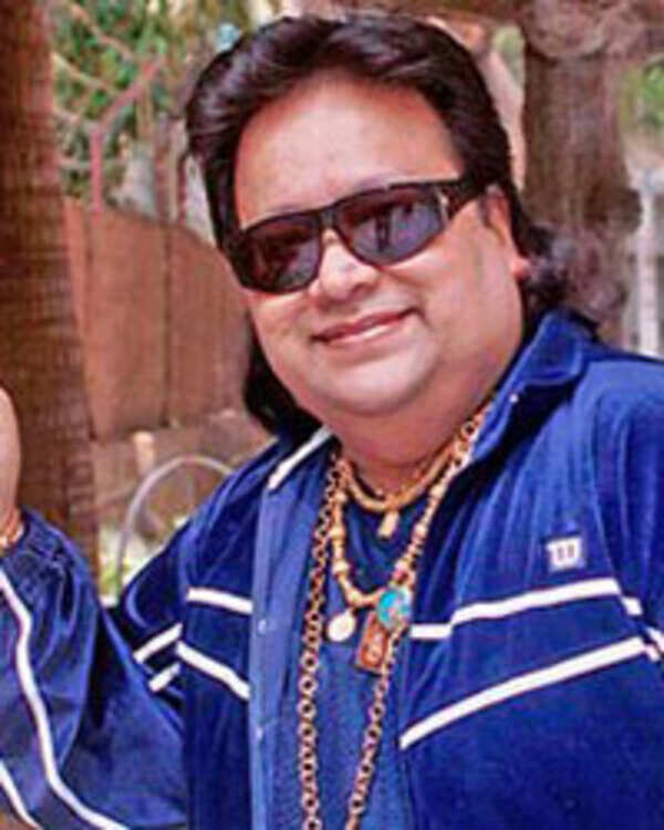Bappi Lahiri gives away his gold - Times of India