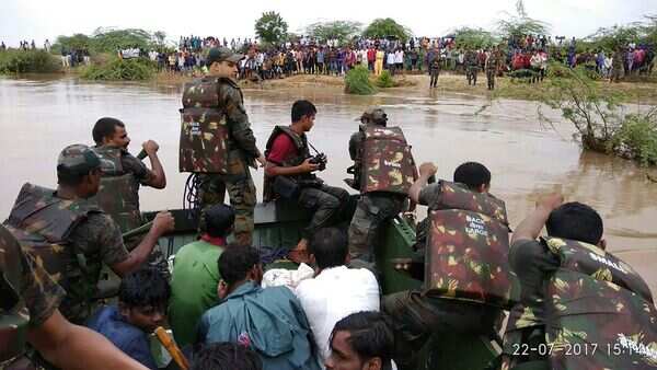 Gujarat Flood: Incessant rains lash Gujarat, over 7,000 people relocated in two days | India ...