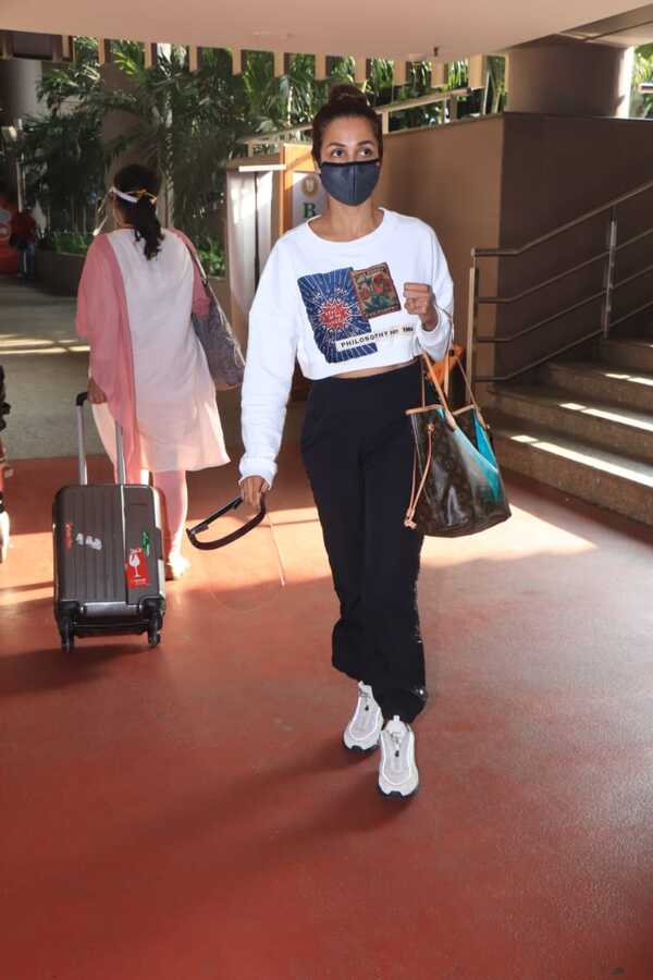Photos: Malaika Arora looks comfy and chic as she returns from her Goa ...