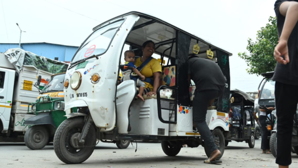Noida: Baby strapped to her, single mom drives e-rickshaw for a living ...