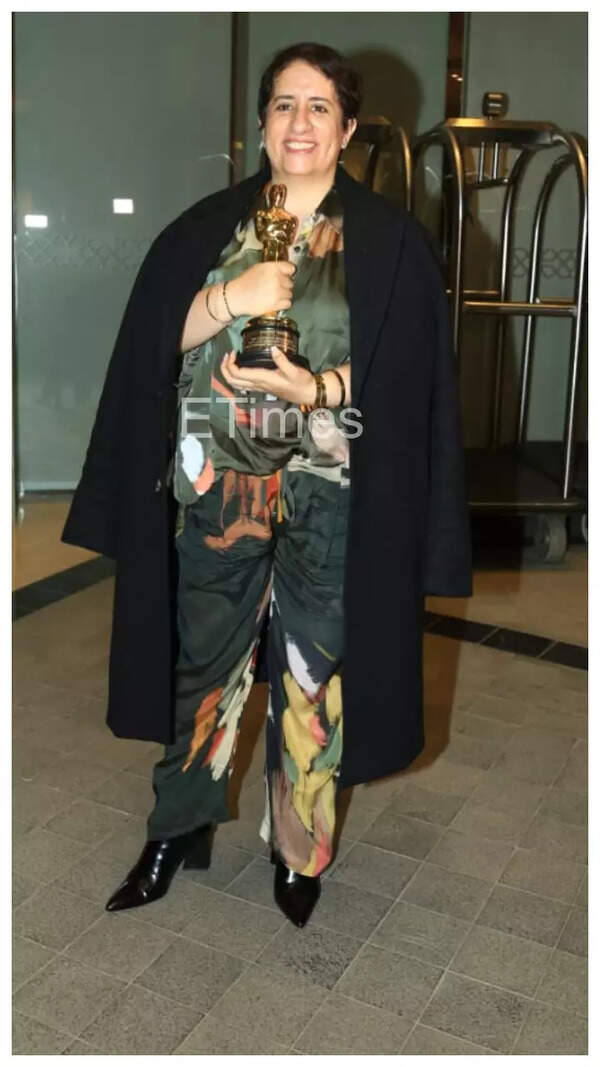 Guneet Monga receives a hero welcome at the Mumbai airport as she ...