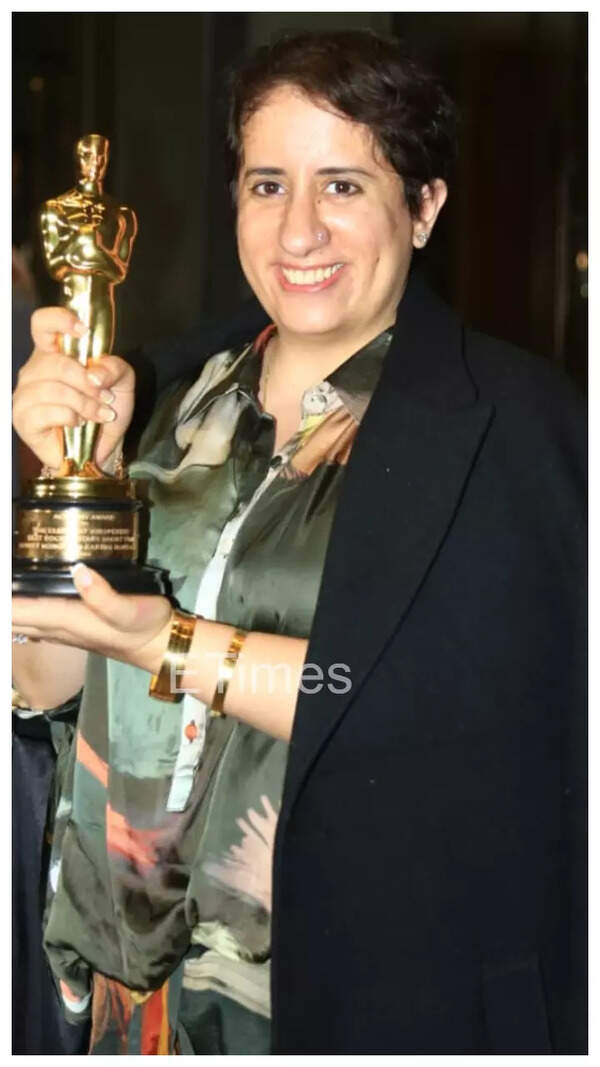 Guneet Monga receives a hero welcome at the Mumbai airport as she ...