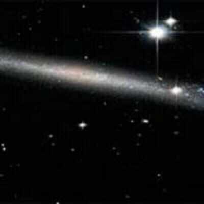 NASA eyes spiraling razor-thin galaxy