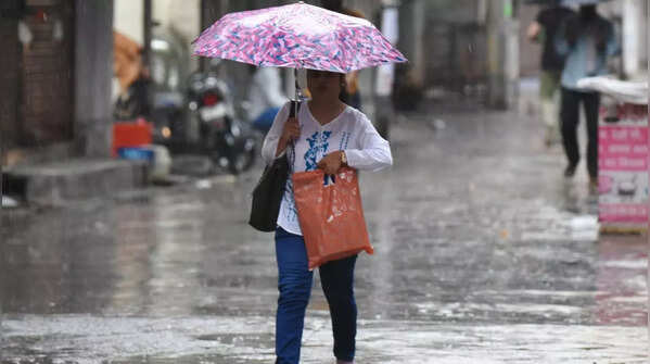 Photos Splash Of Rain Brings Respite From Heat In Delhi Ncr