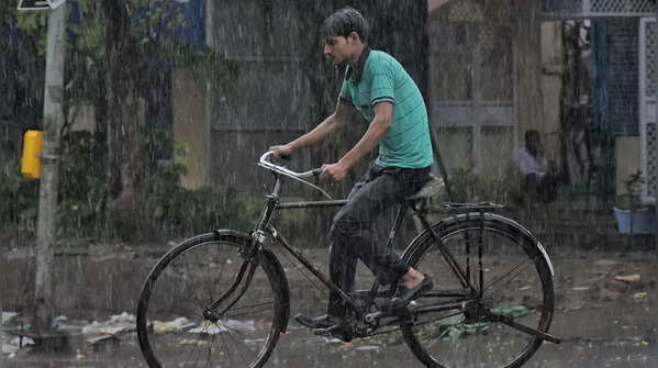 Photos Splash Of Rain Brings Respite From Heat In Delhi Ncr