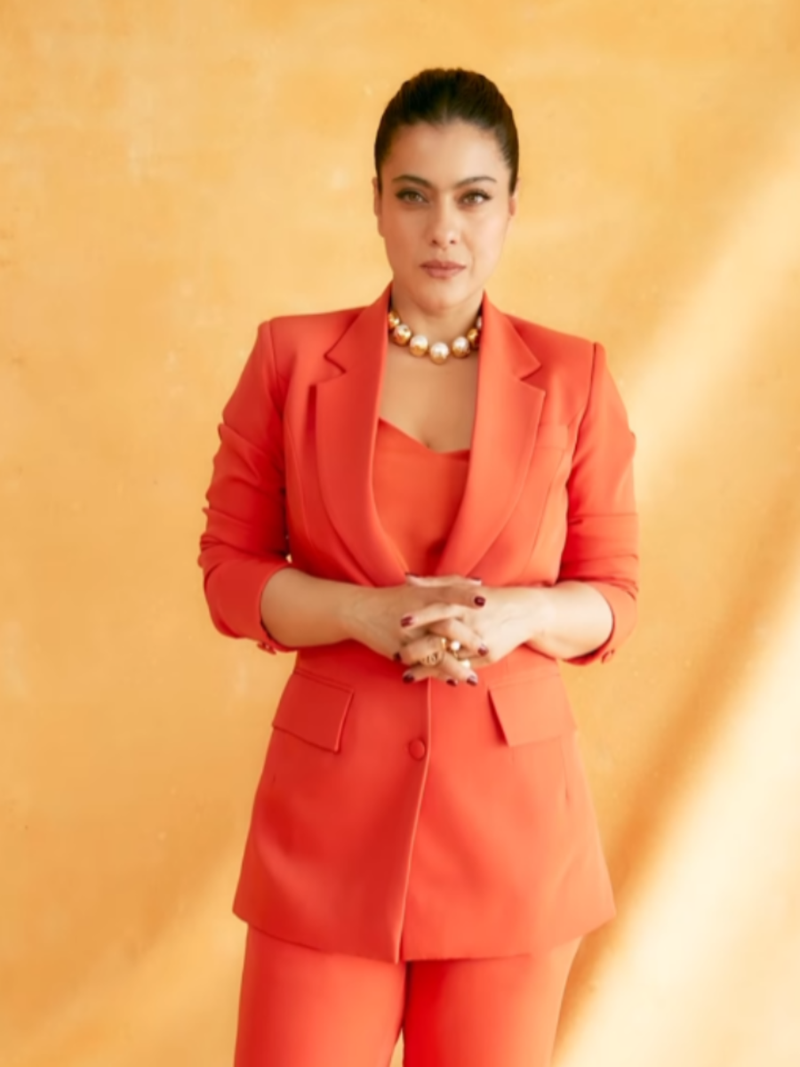 Kajol poses like a boss in orange pantsuit | TOIPhotogallery