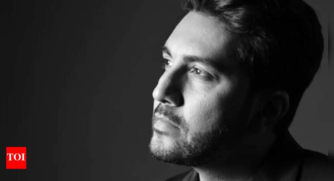 Parth Oza sets a timeless Sunday mood in dapper black suite | Gujarati Movie News - Times of India