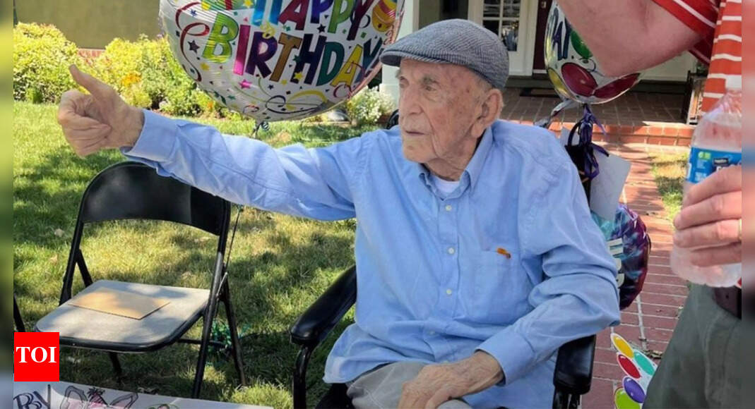 Man celebrates 100th birthday with 200 dogs - Times of India